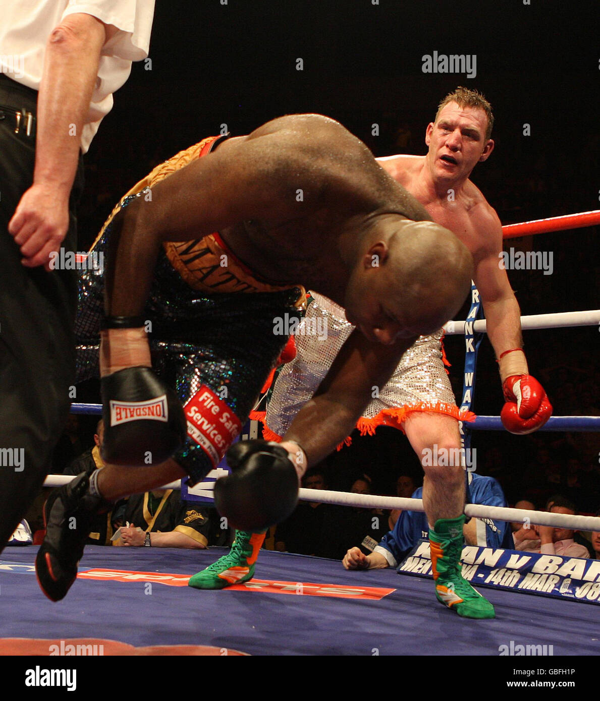 Belfast's Martin Rogan knocks down Bedford's Matt Skelton during the ...