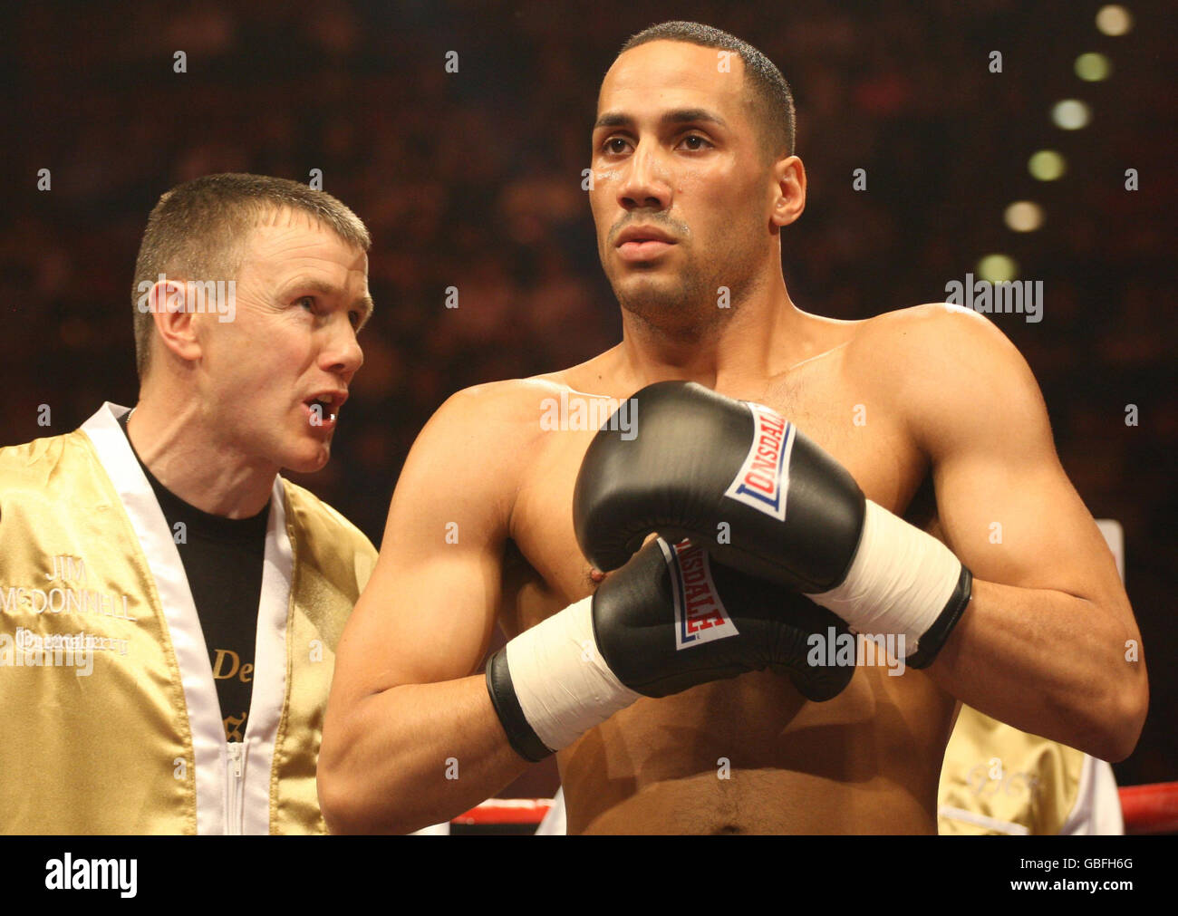 James DeGale listens to instructions from trainer Jimmy McDonnell ...