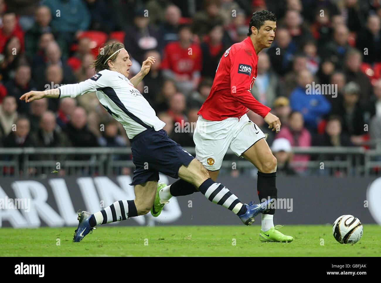 Tottenham Hotspur's Luka Modric (left) challenges Manchester United's ...