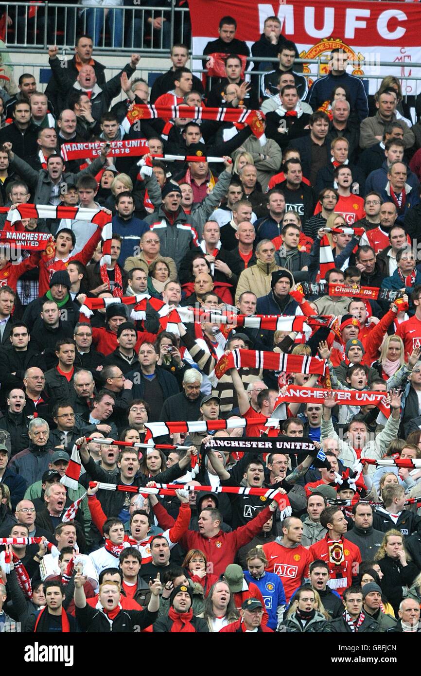 Tottenham hotspur fans cheer on their side in the stands hi-res stock ...