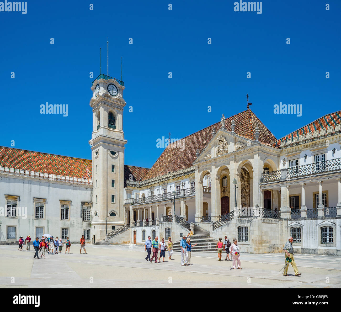 Coimbra, Portugal - June 21, 2016. Tourists crossing Patio das Escolas ...
