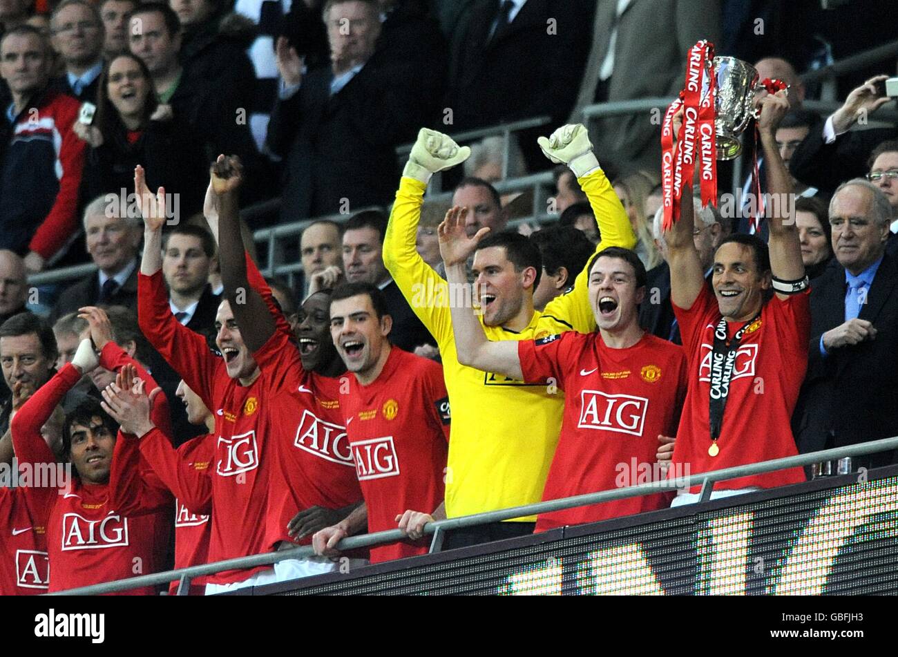 Manchester united captain rio ferdinand lifts the carling cup trophy hi ...