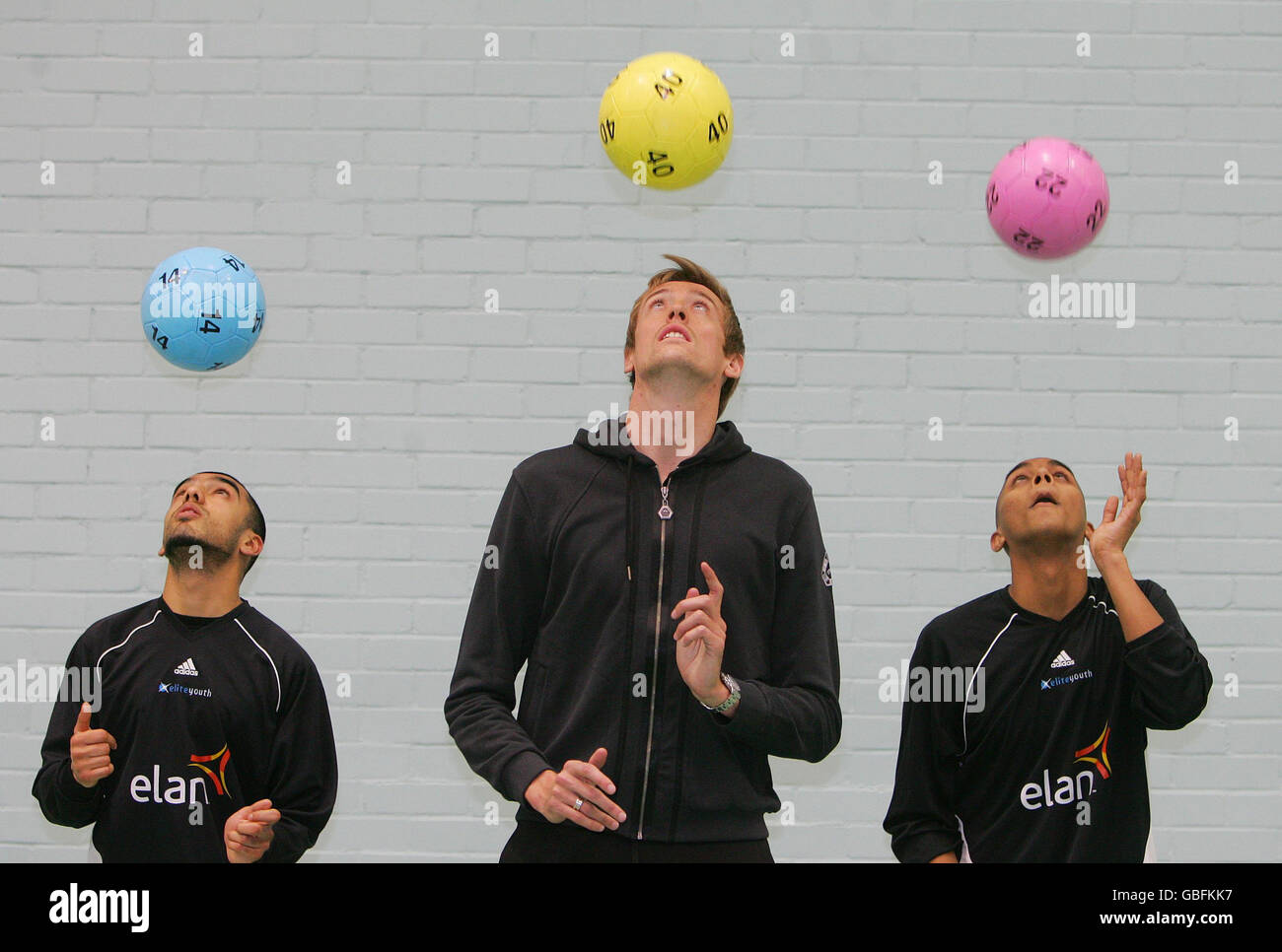 England and Portsmouth footballer Peter Crouch gives inner city teens Bilal Awan (left) and ...