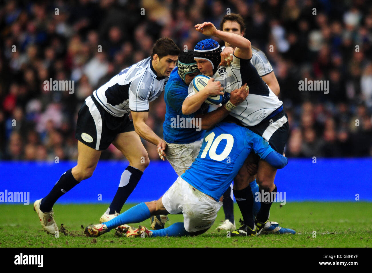 Scotland's Dougie Hall is tackled by Italy's Luke McLean (10 Stock ...