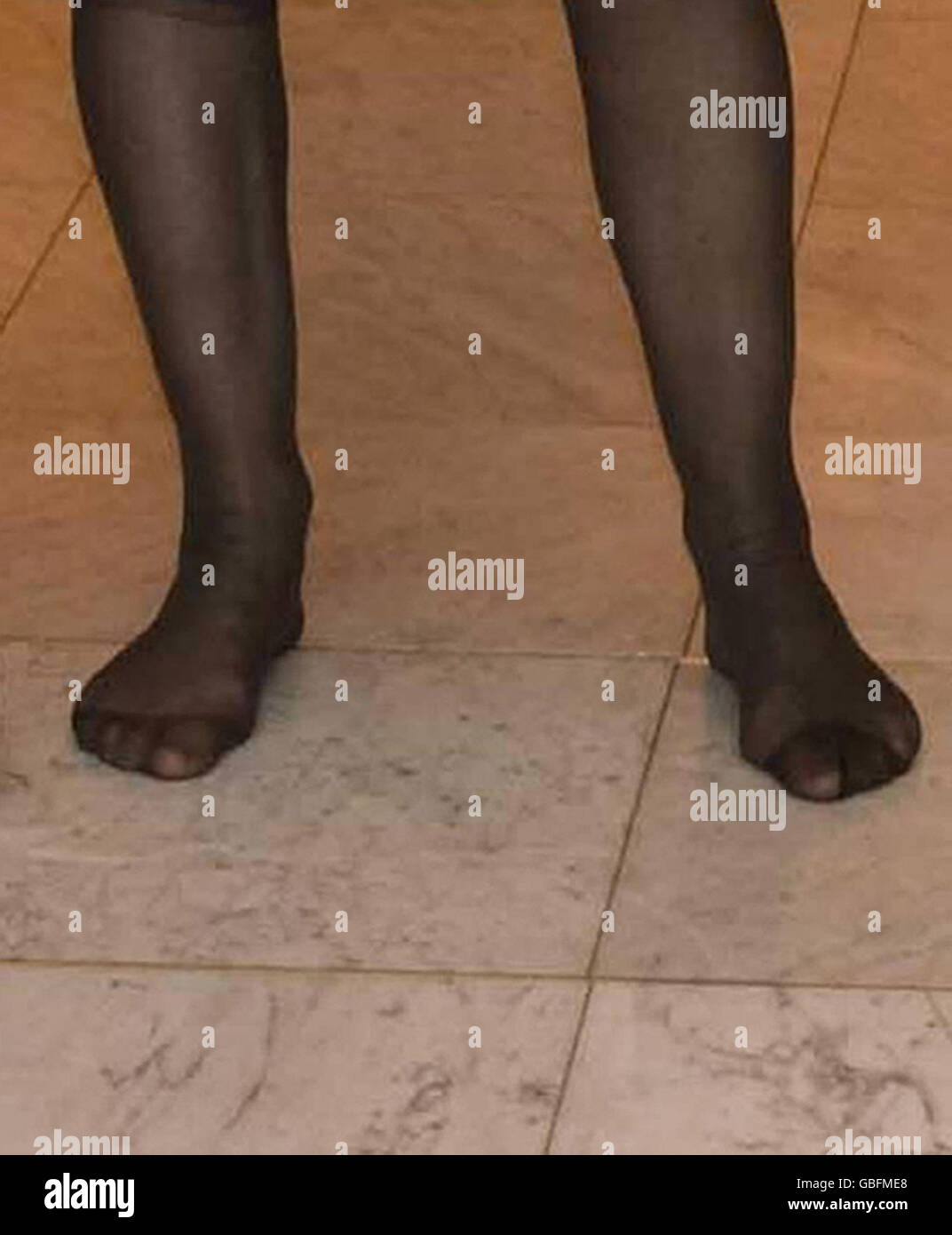 The stockinged feet of The Duchess of Cornwall during a tour of the ...