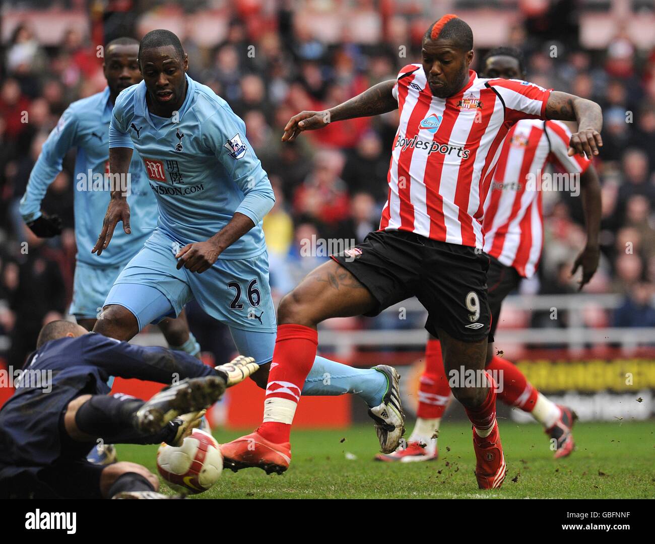 Tottenham Hotspur goalkeeper Heurelho Gomes dives at the feet of ...