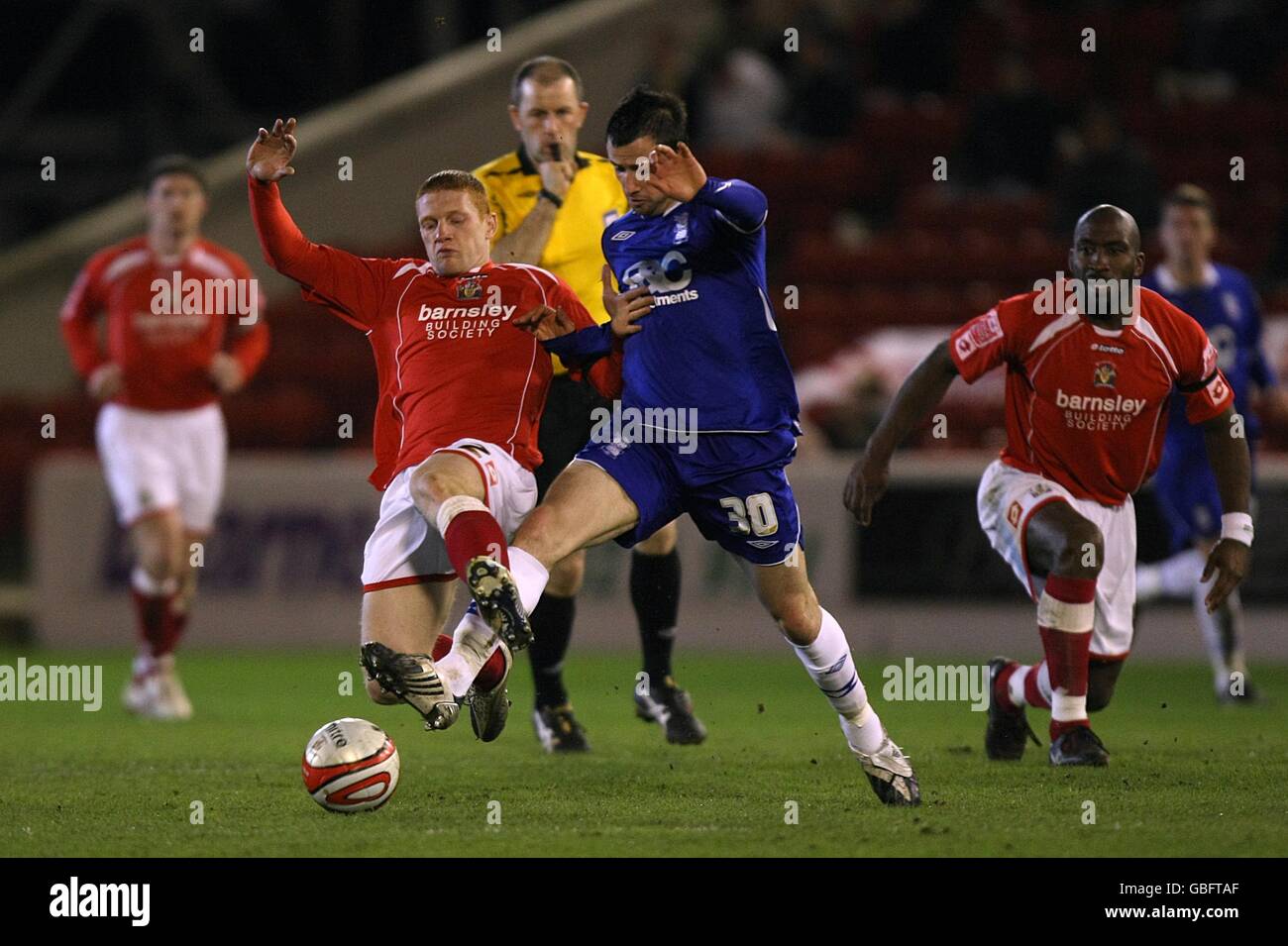 Birmingham City's Keith Fahey (right centre) and Barnsley's Bobby ...