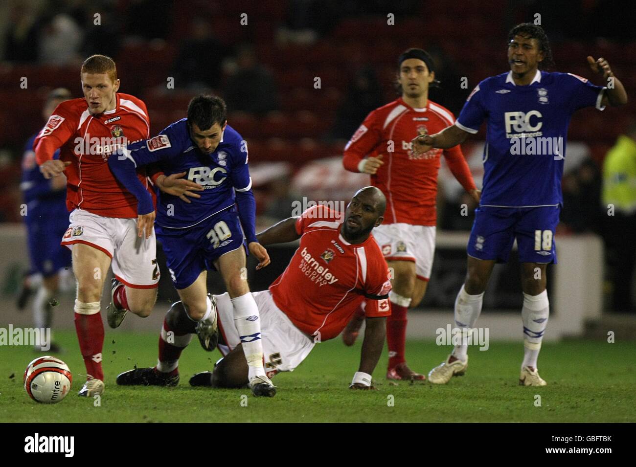 Birmingham City's Keith Fahey (second left)) battles for the ball with ...