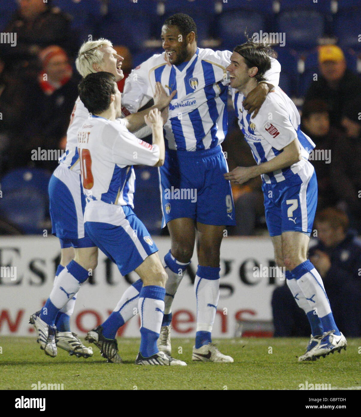 Colchester's Clive Platt (centre) celebrates his first goal during the ...
