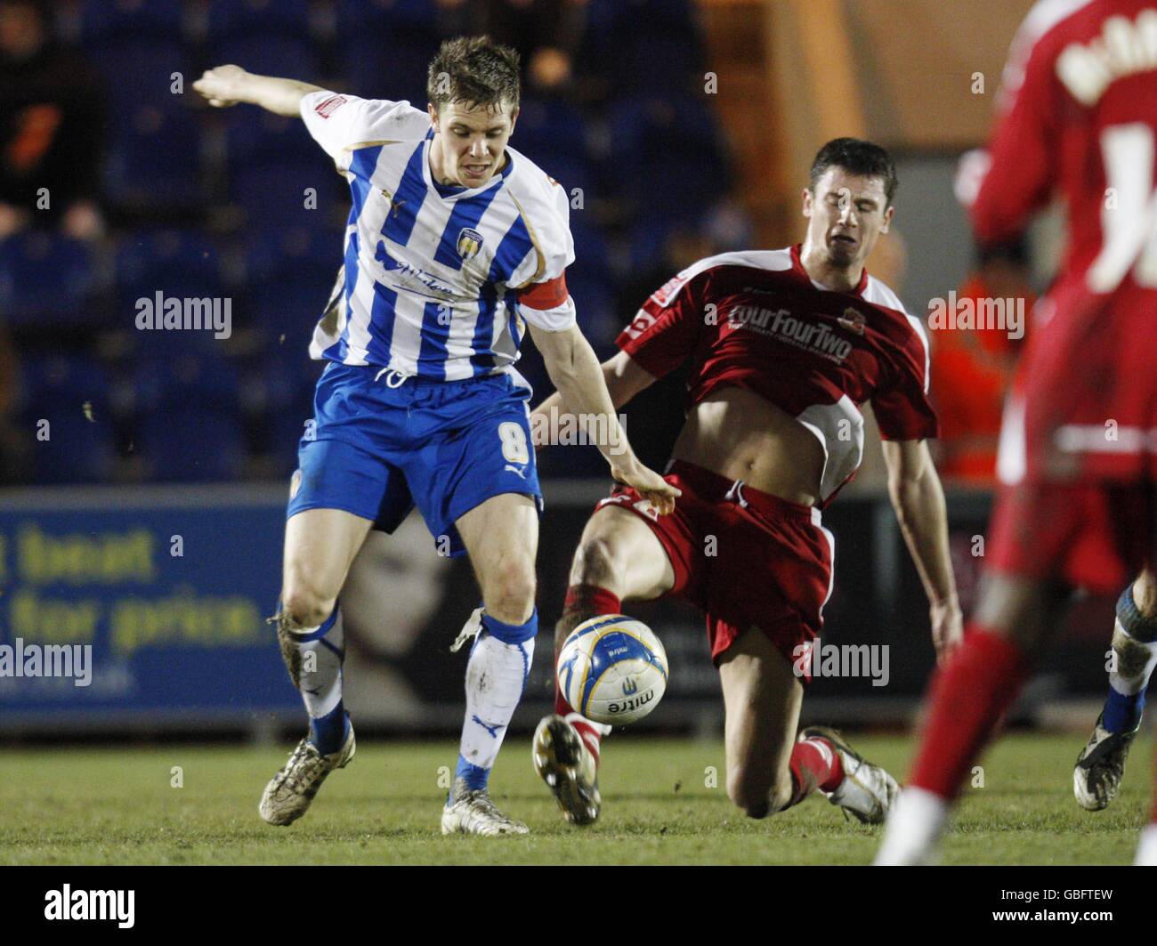 Swindons Owain Tudur Jones and Colchesters Dean Hammond battle for the ...