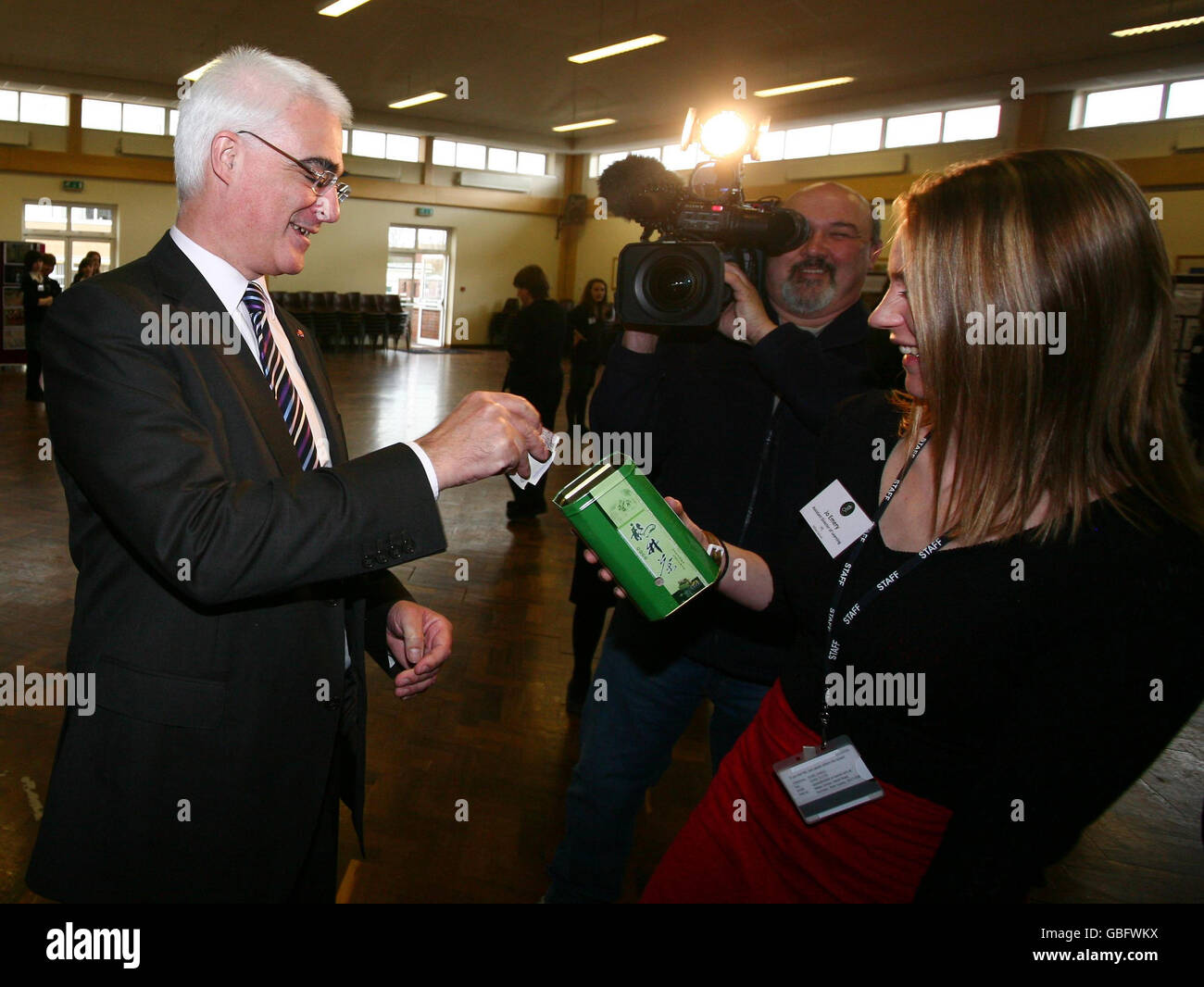 Chancellor Alistair Darling places money for Comic Relief in a ...