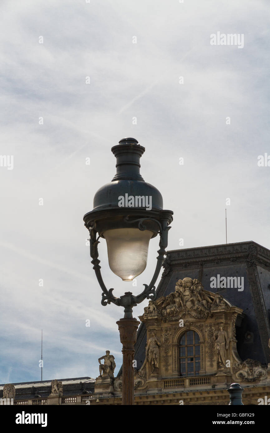 Parisian streetlamp, with gablestone of building in background Stock ...