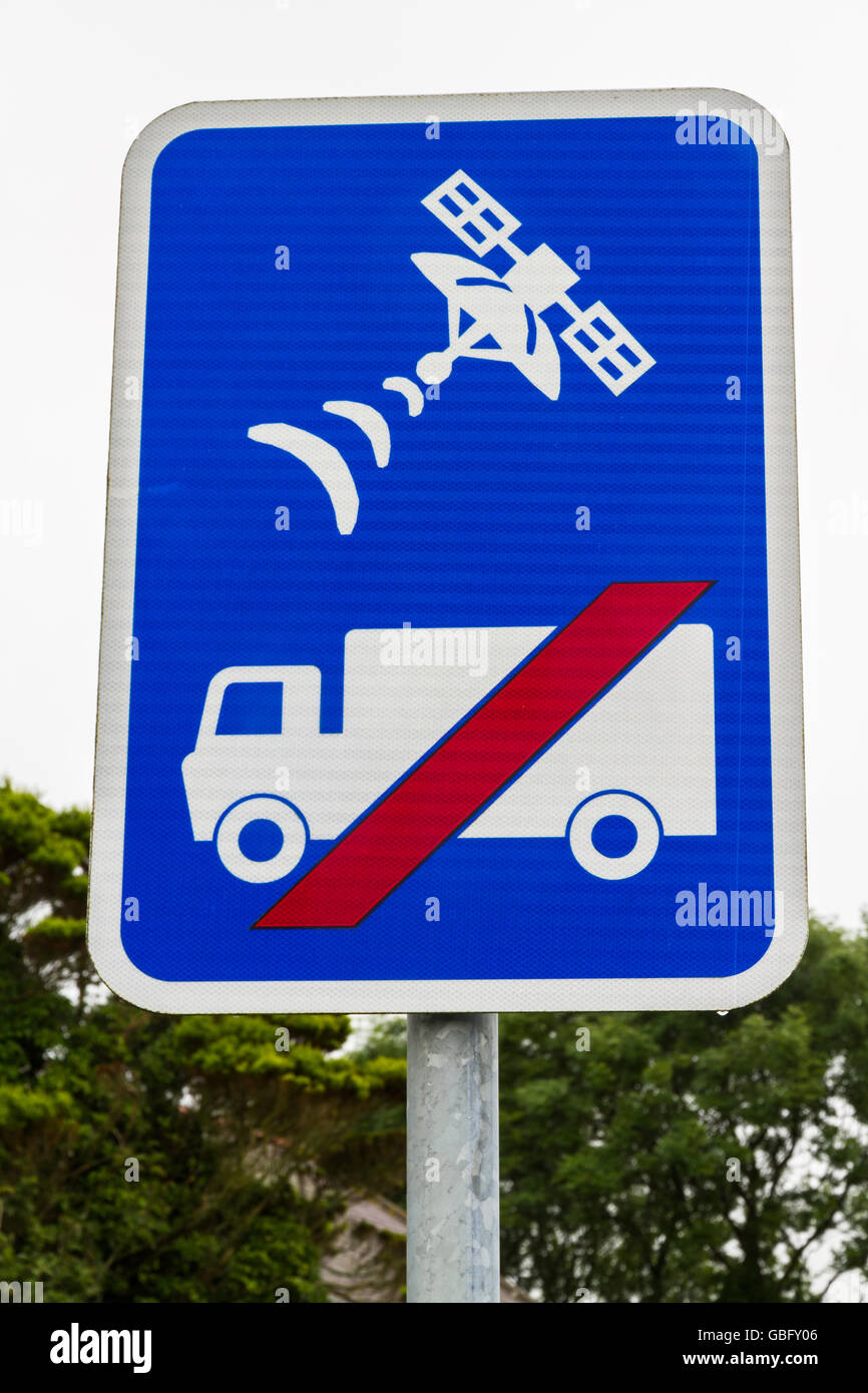 Blue sign showing lorry or HGV with red line through it and a satellite ...
