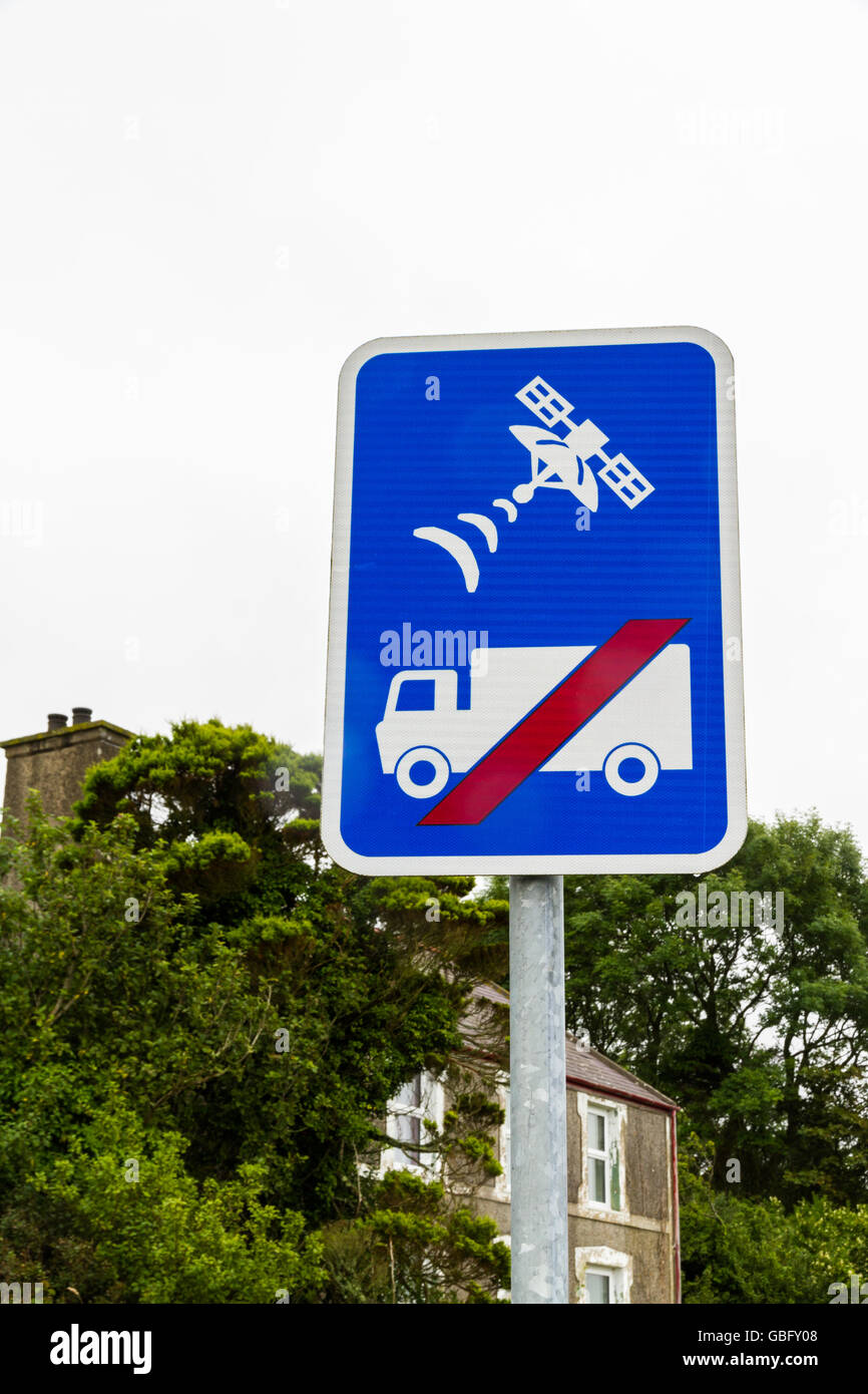 Blue sign showing lorry or HGV with red line through it and a satellite ...