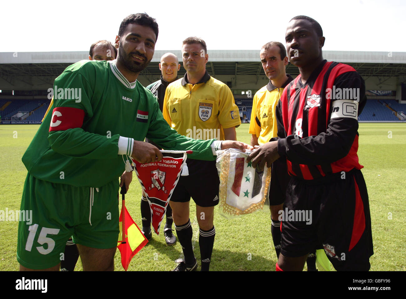 Iraq's Hassam Fawi and Trinidad & Tobago Angus Eve exchange pennants ...