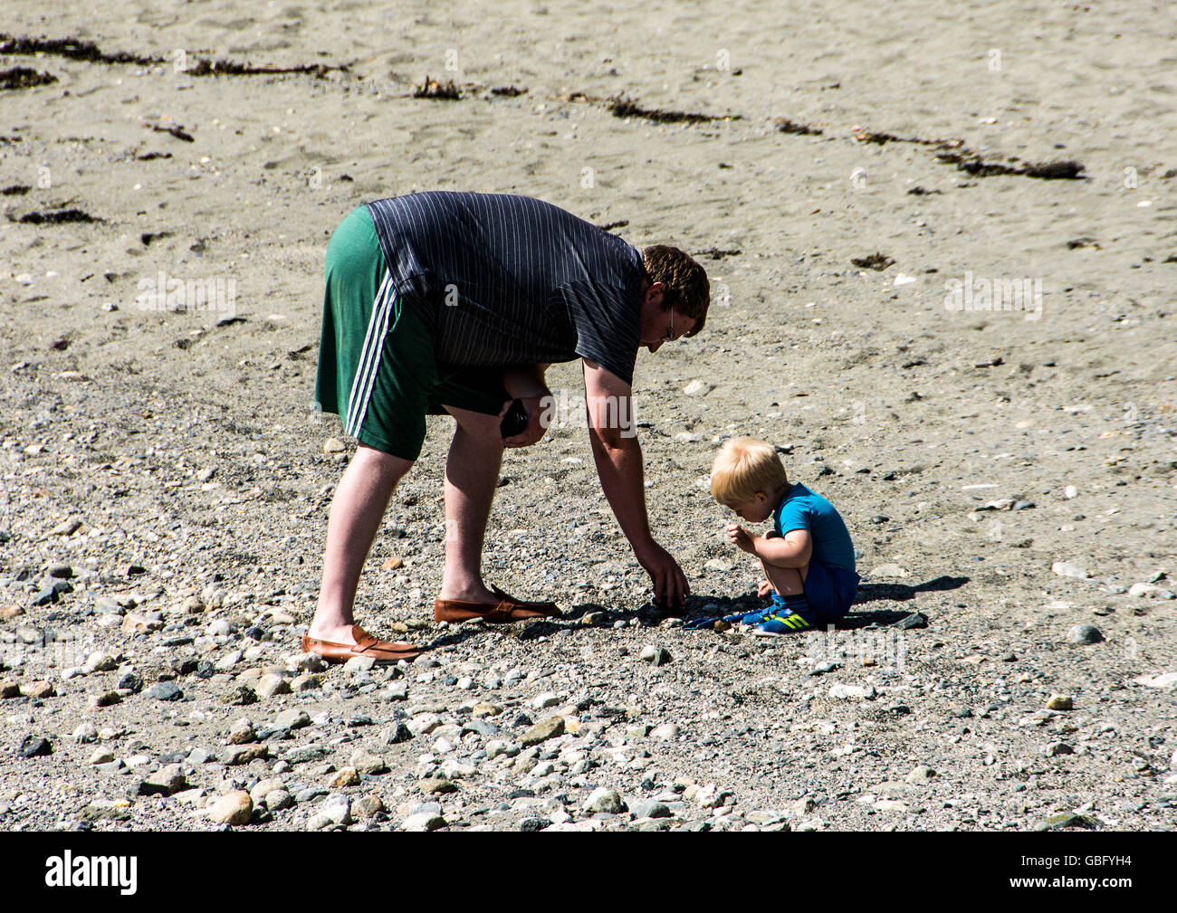 A man and his son on a beach at Flam, Norway Stock Photo - Alamy