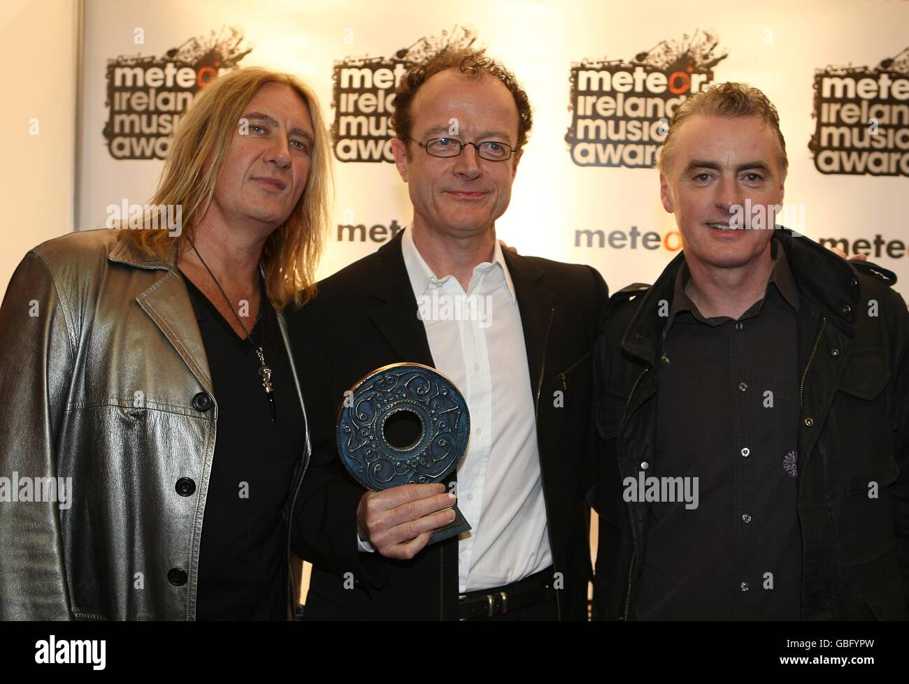 Niall Stokes with his Industry Award joined by Dave Fanning (right) and ...