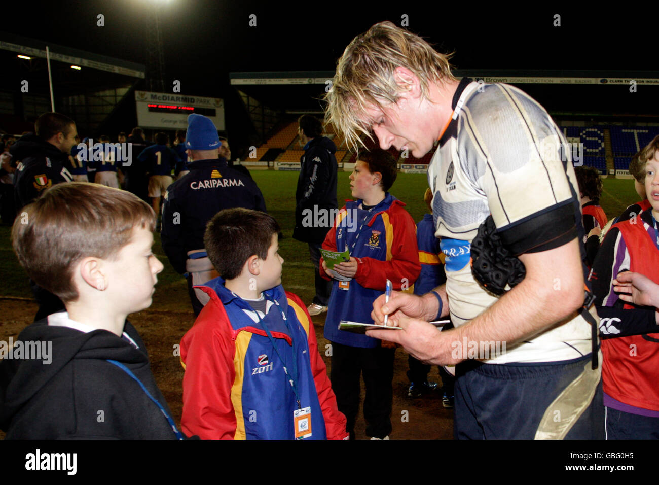 Scotland A's Scott Macleod signs autographs for young fans Stock Photo ...