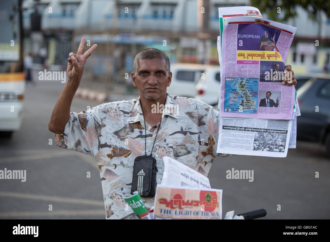 Newspaper man reading myanmar hi-res stock photography and images - Alamy