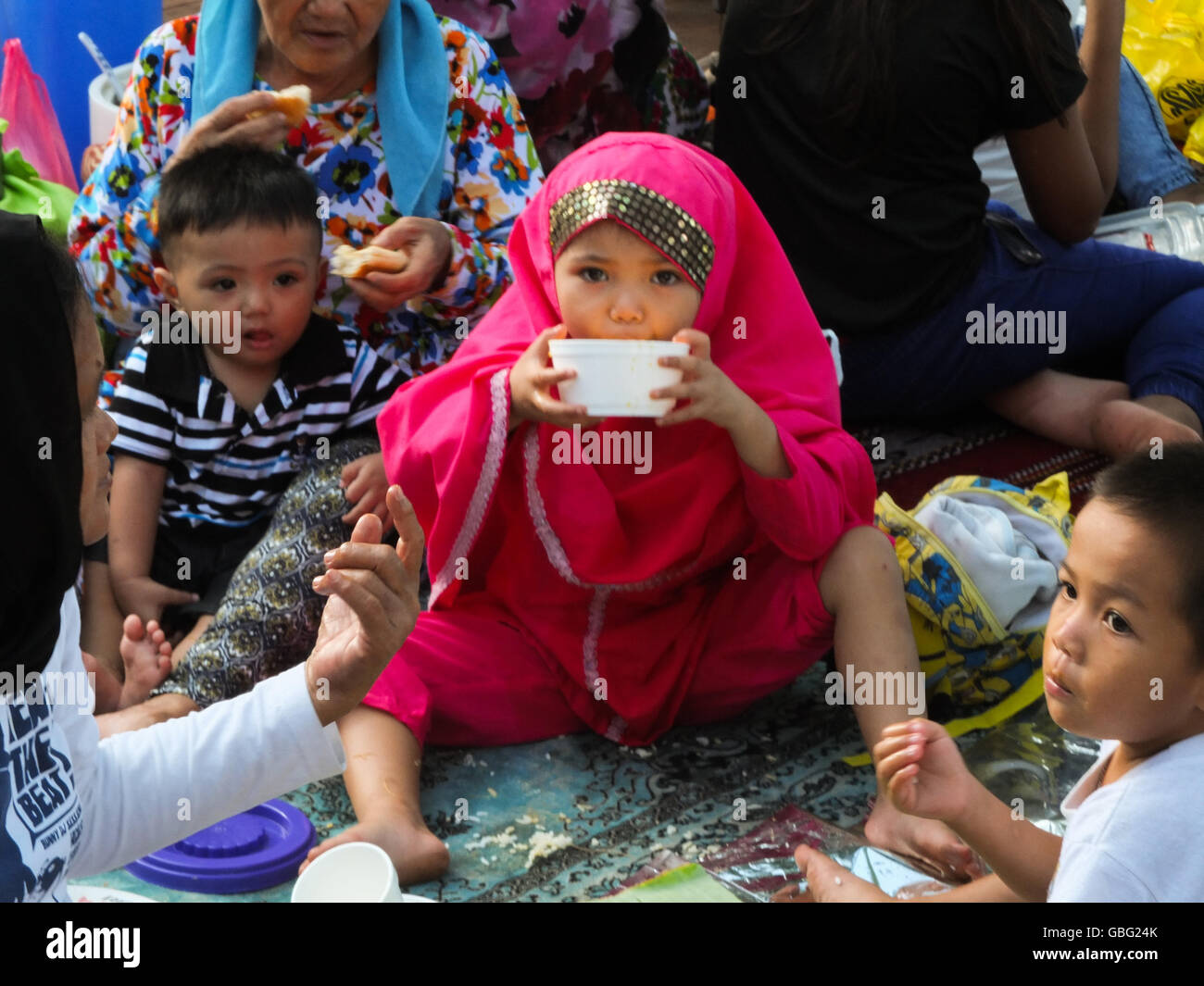 Manila, Philippines. 06th July, 2016. A Muslim child eating during the ...