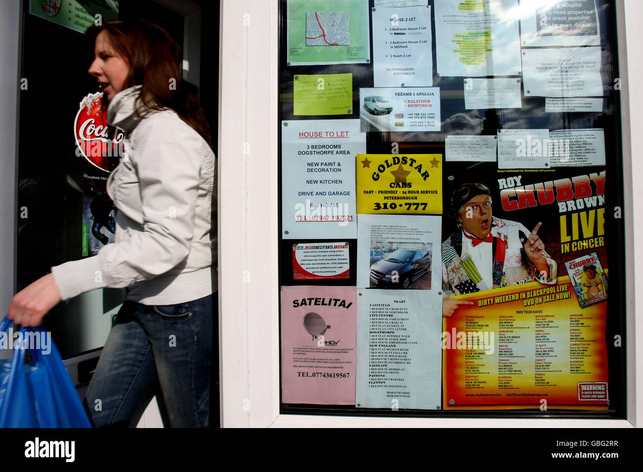 Notices in a shop window in Peterborough city centre, Cambridgeshire ...