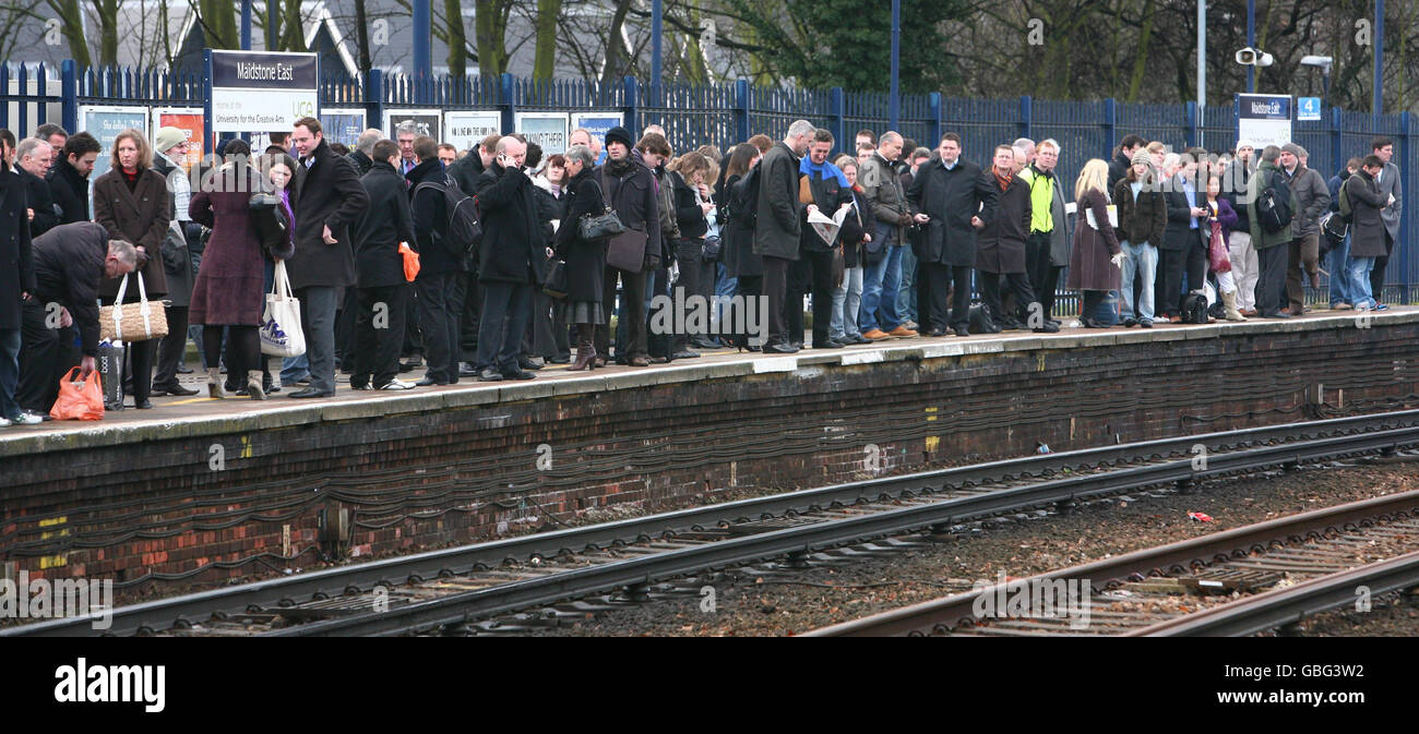 Commuters wait on the platform at Maidstone East Railway Station in ...