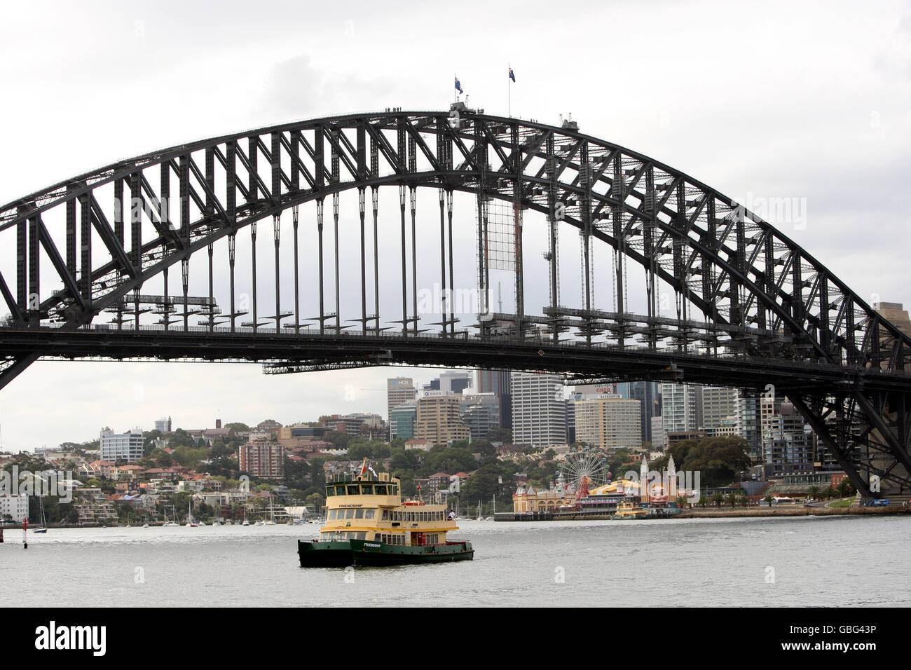 General view sydney harbour bridge ferry makes its way underneath hi ...