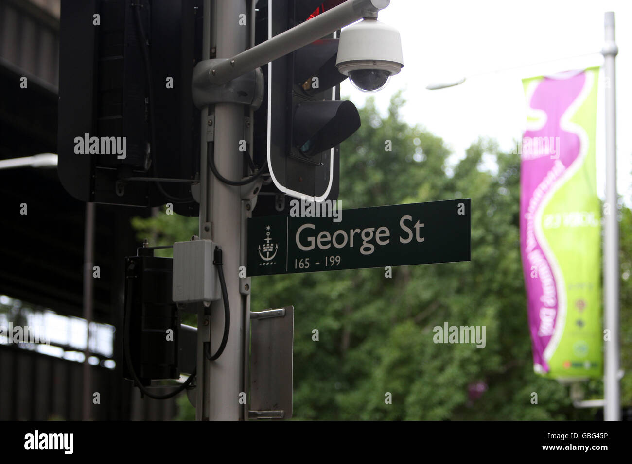 General view of a sign for George St on a traffic light post near to ...