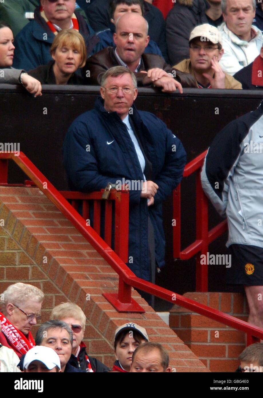 Manchester United manager Sir Alex Ferguson keeps a watchful eye on his ...
