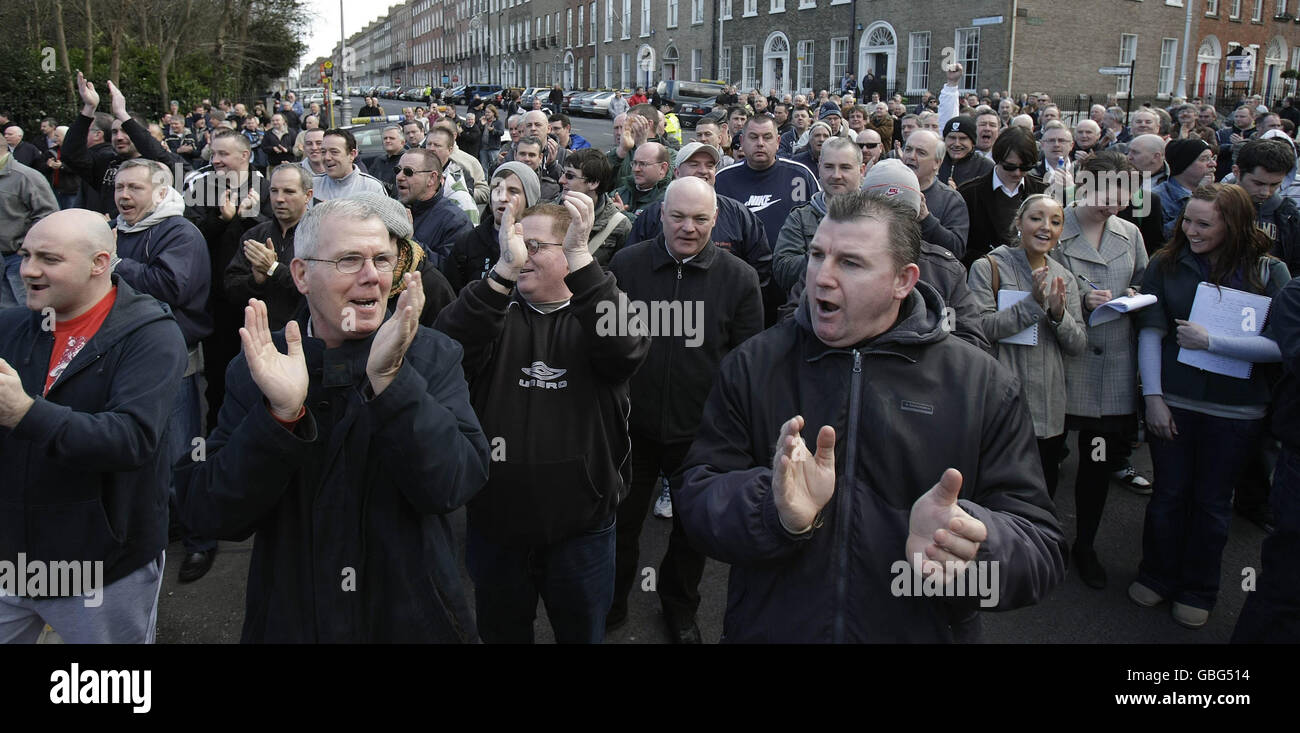 Hundreds of striking taxi drivers clap during a protest for better ...