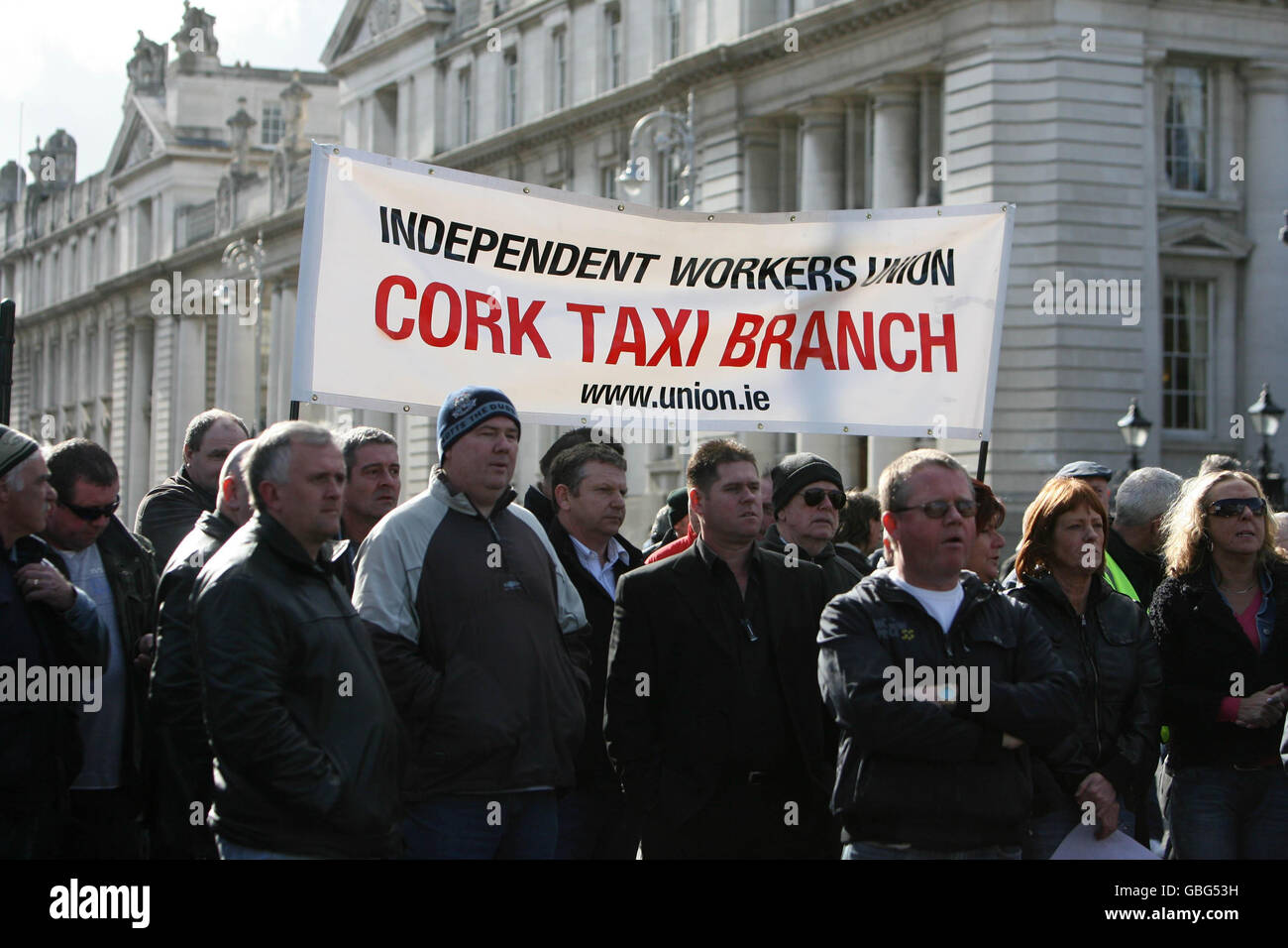 Taxi drivers carry banners during a protest for better regulation for ...