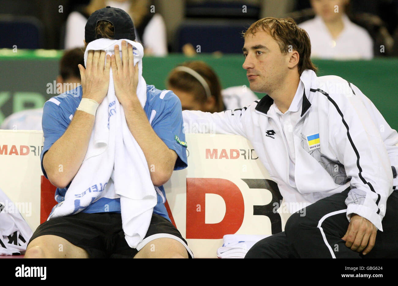 Ukraine coach Orest Tereshchuk consoles Illya Marchenko after losing ...