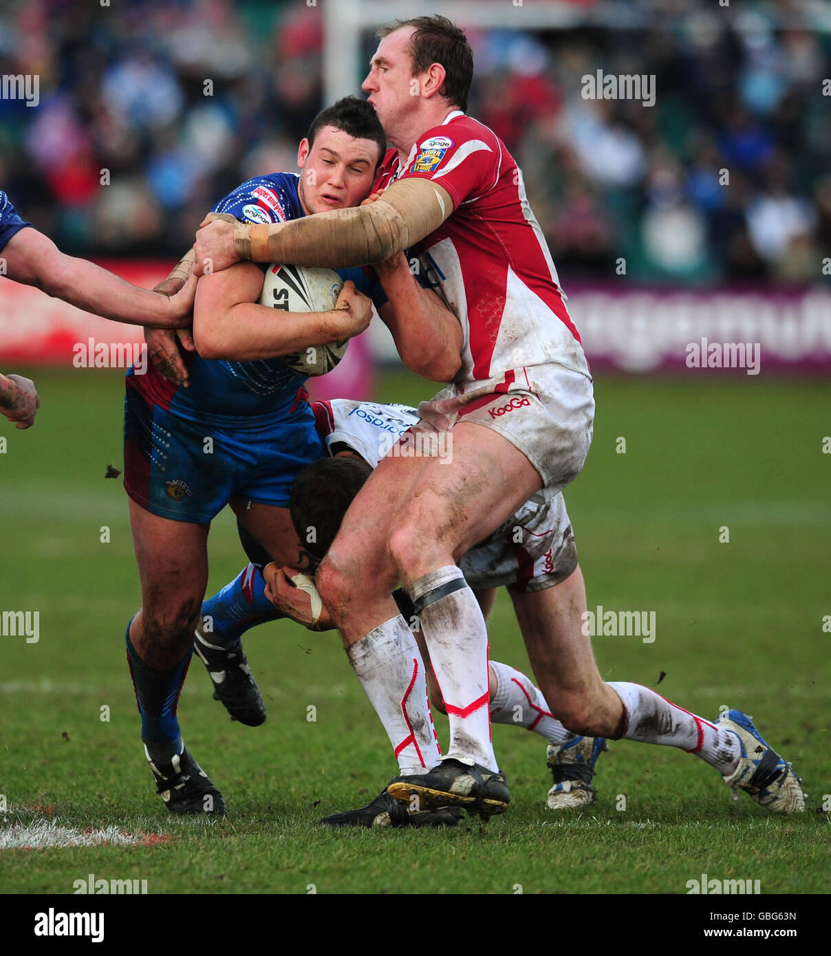 Wakefield's Jay Pitts is tackled by Hull KR's Chaz I'Anson and Nick ...