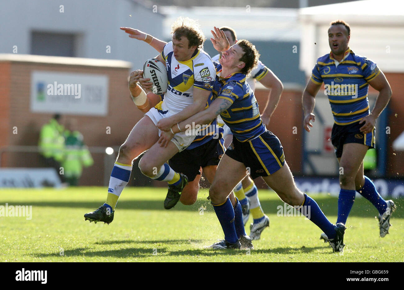 Warrington's Mickey Higham is tackled by Danny Allan during the engage ...