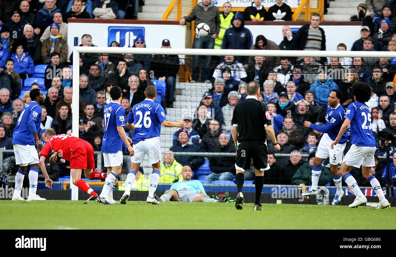 Everton's goalkeeper Tim Howard lies on the floor after throwing the ...