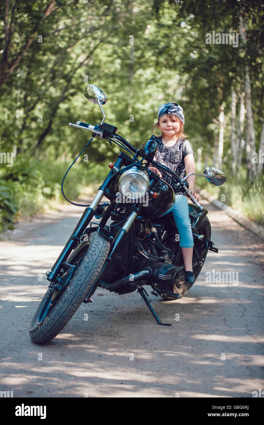 Little girl on a motorcycle Stock Photo - Alamy