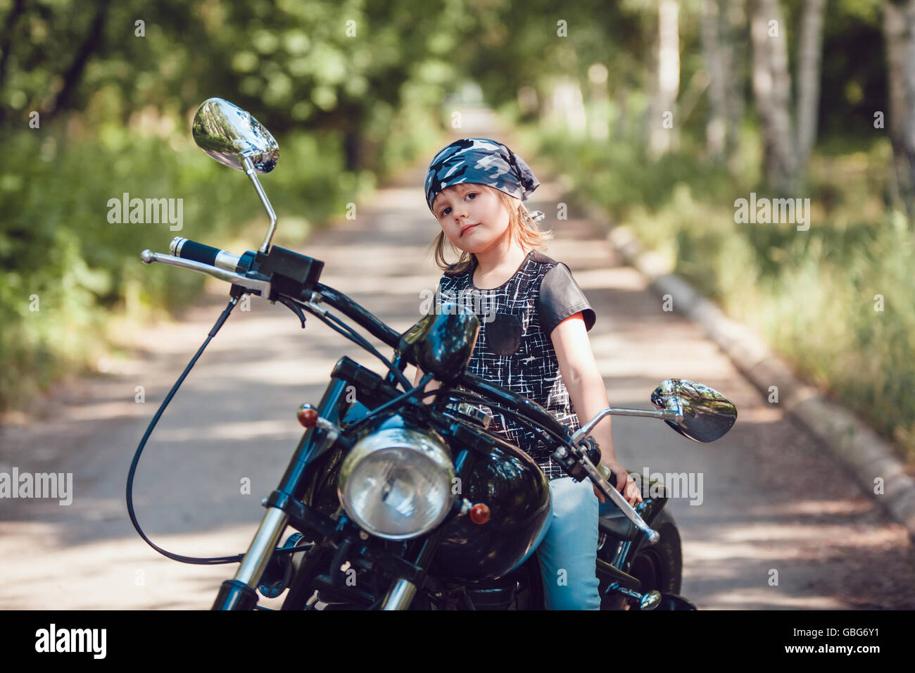 Little girl on a motorcycle Stock Photo - Alamy