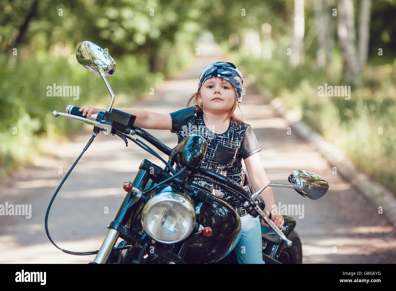 Little girl on a motorcycle Stock Photo - Alamy