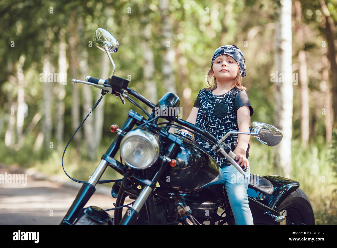 Little girl on a motorcycle Stock Photo - Alamy