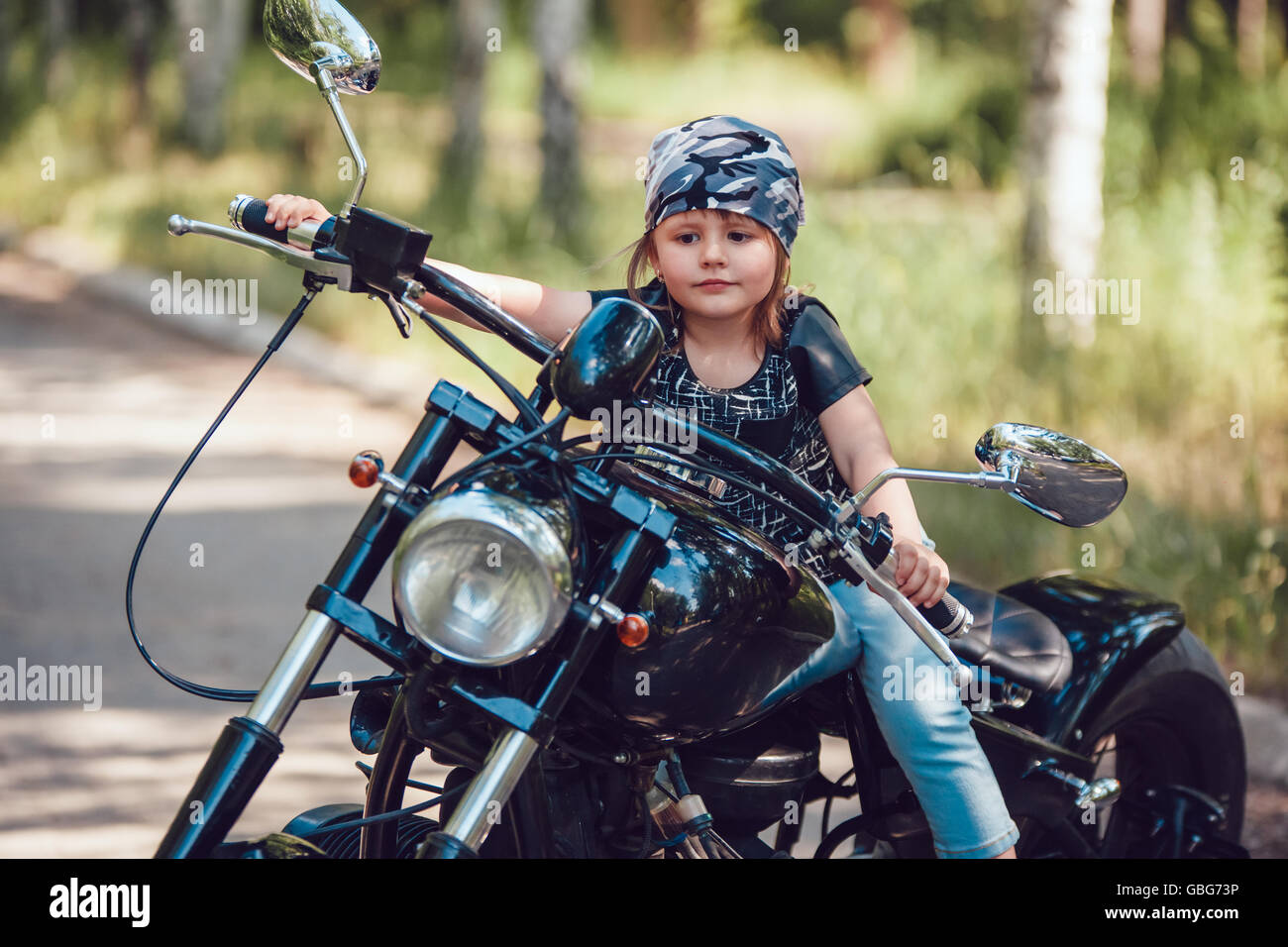 Little girl on a motorcycle Stock Photo - Alamy