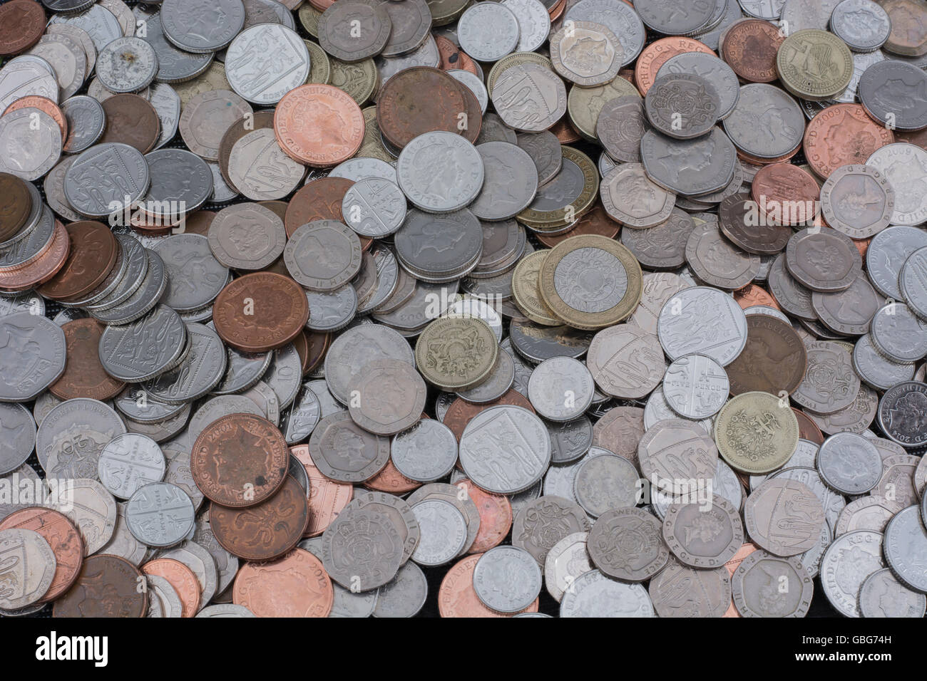 Large pile of randomly scattered British / Sterling coins for concept ...