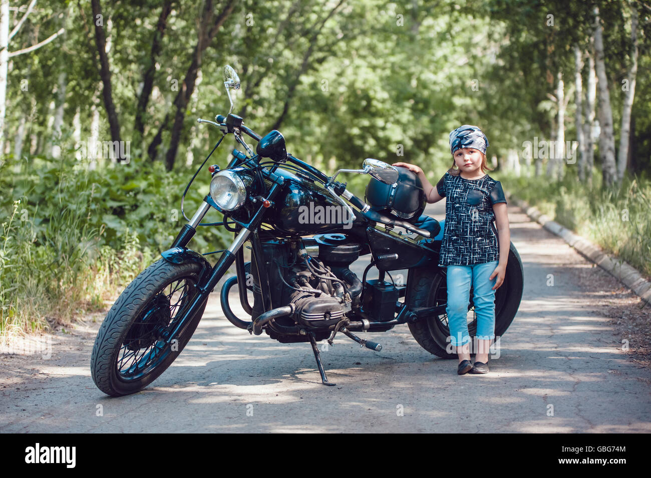 Little girl on a motorcycle Stock Photo - Alamy