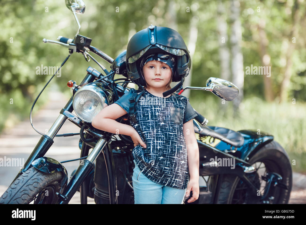 Little girl on a motorcycle Stock Photo - Alamy