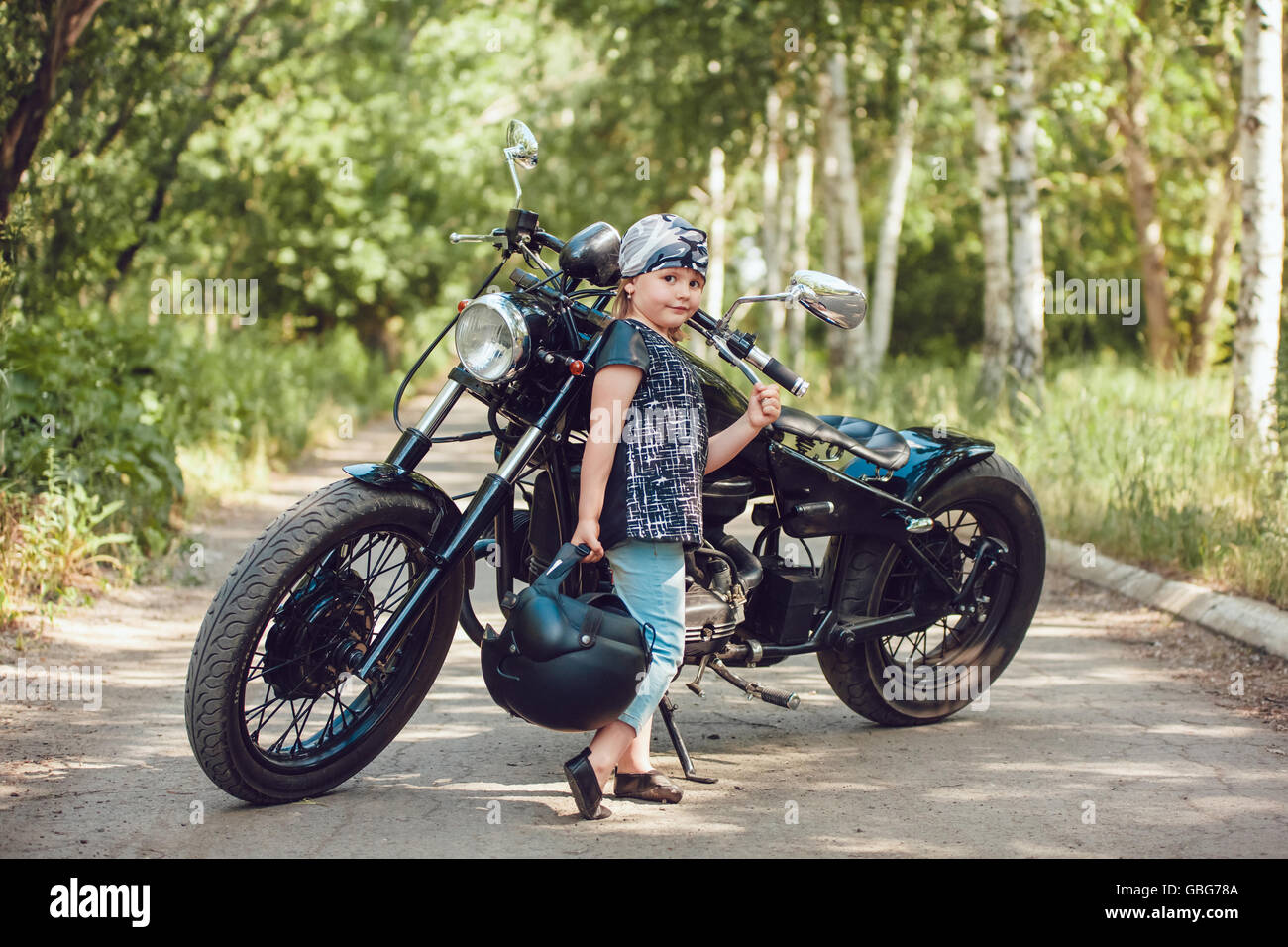 Little girl on a motorcycle Stock Photo - Alamy