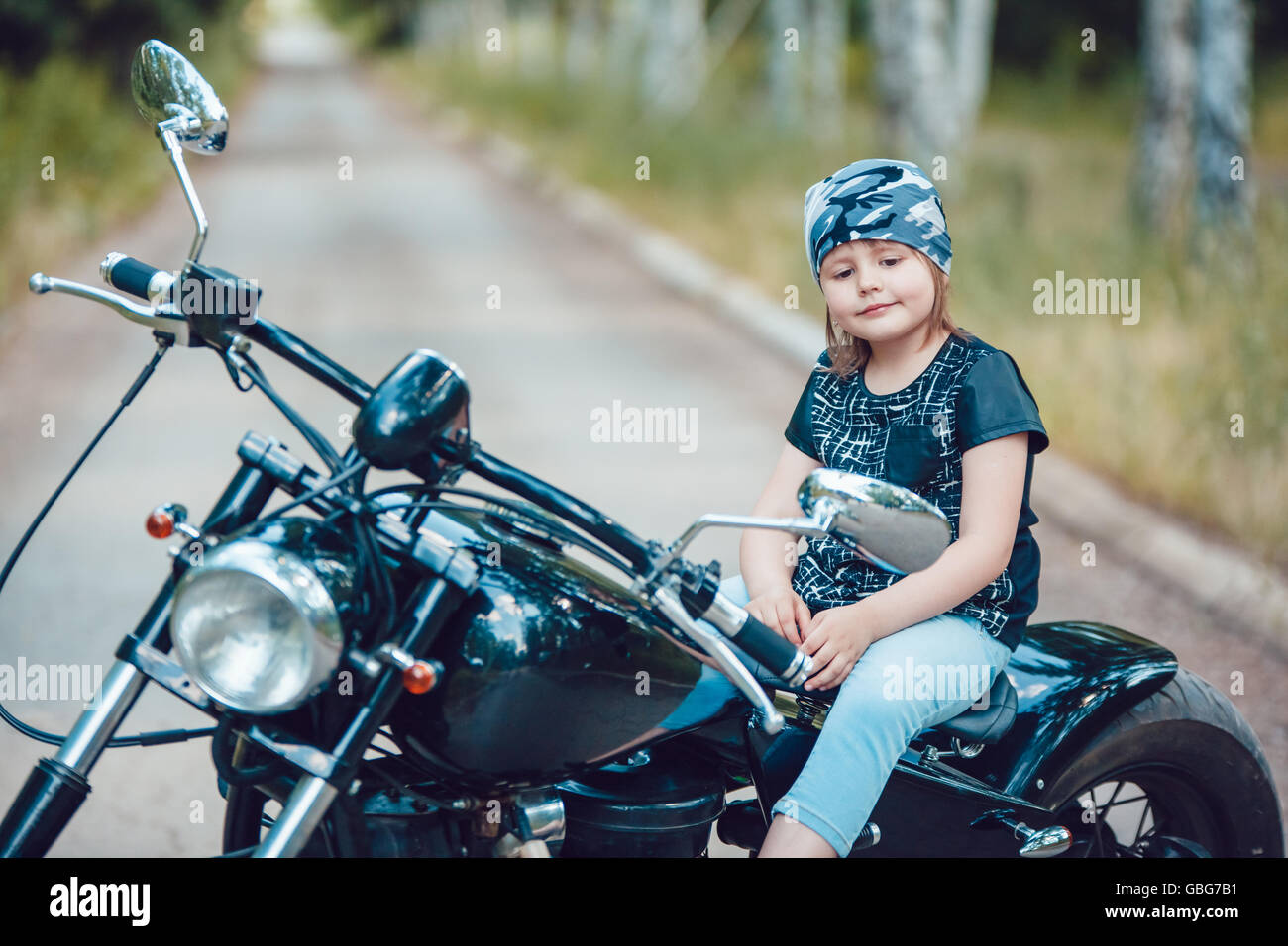 Little girl on a motorcycle Stock Photo - Alamy