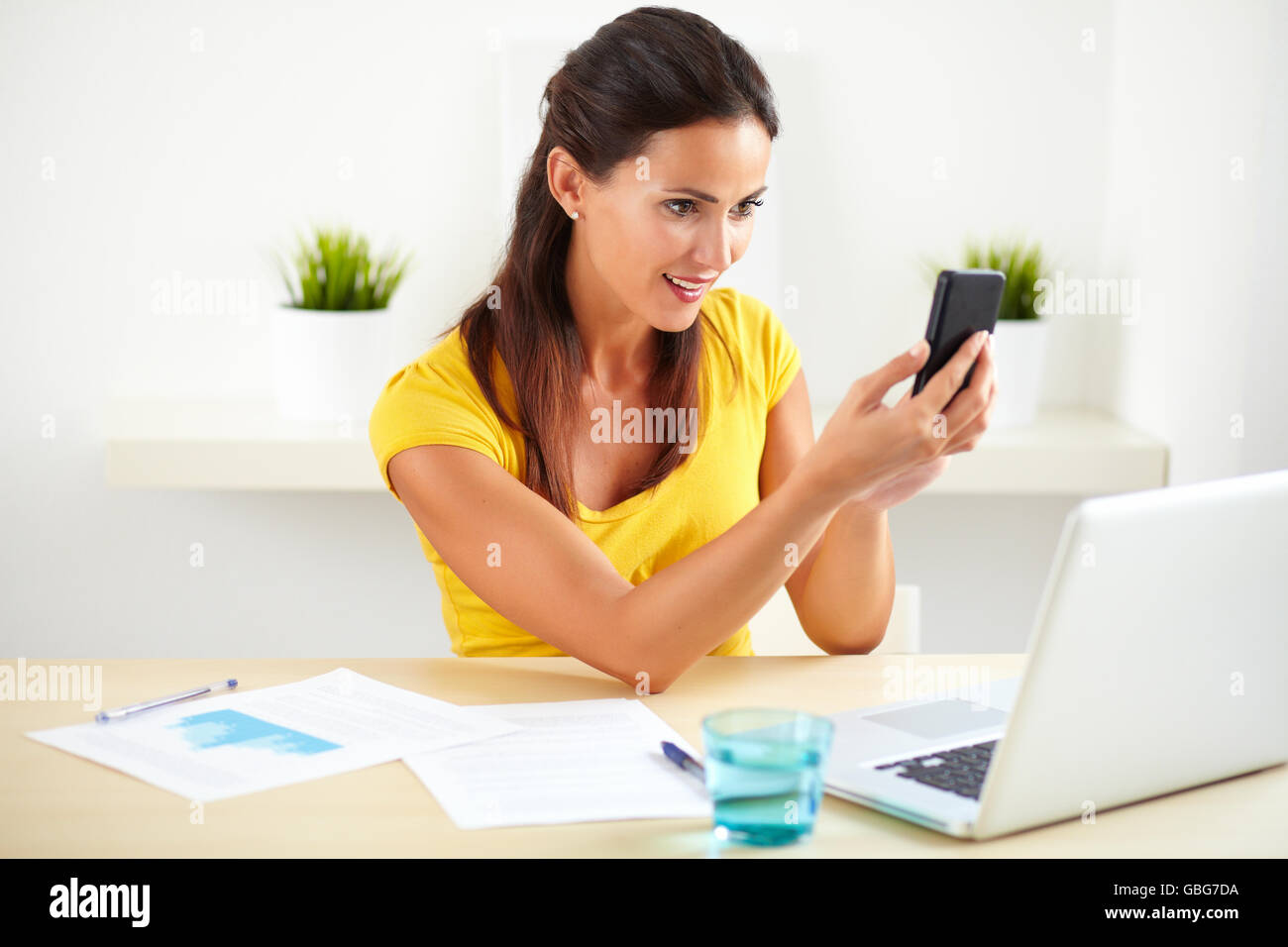 Secretary sitting desk using mobile hi-res stock photography and images ...