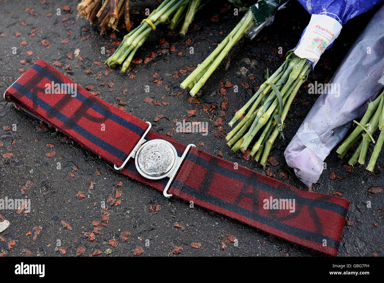 A soldiers belt beside floral tributes left outside Massereene Army ...