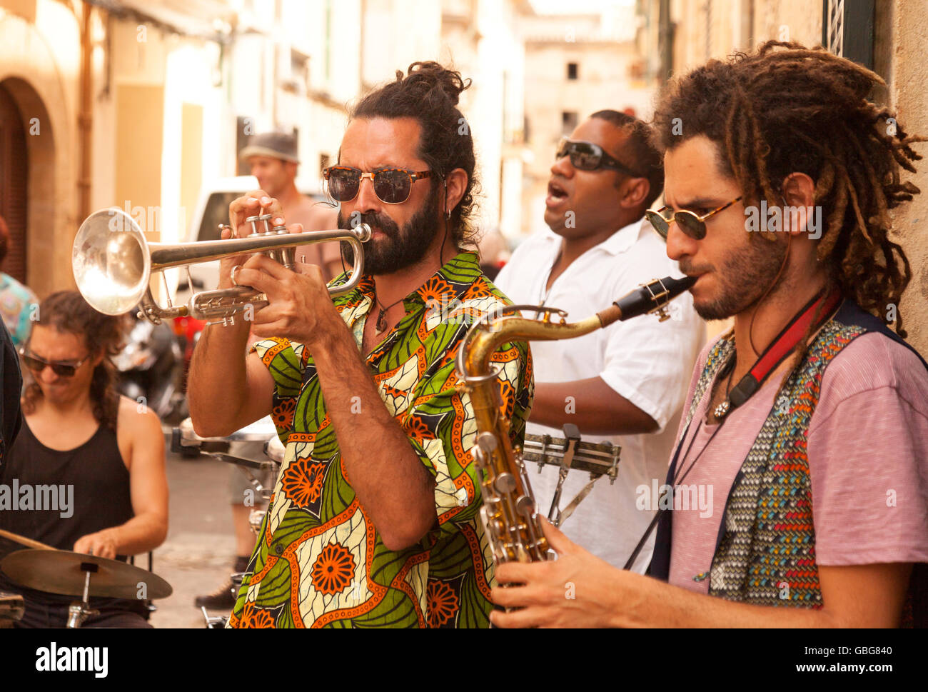 Street musicians playing horn and saxophone, Pollenca old town ...