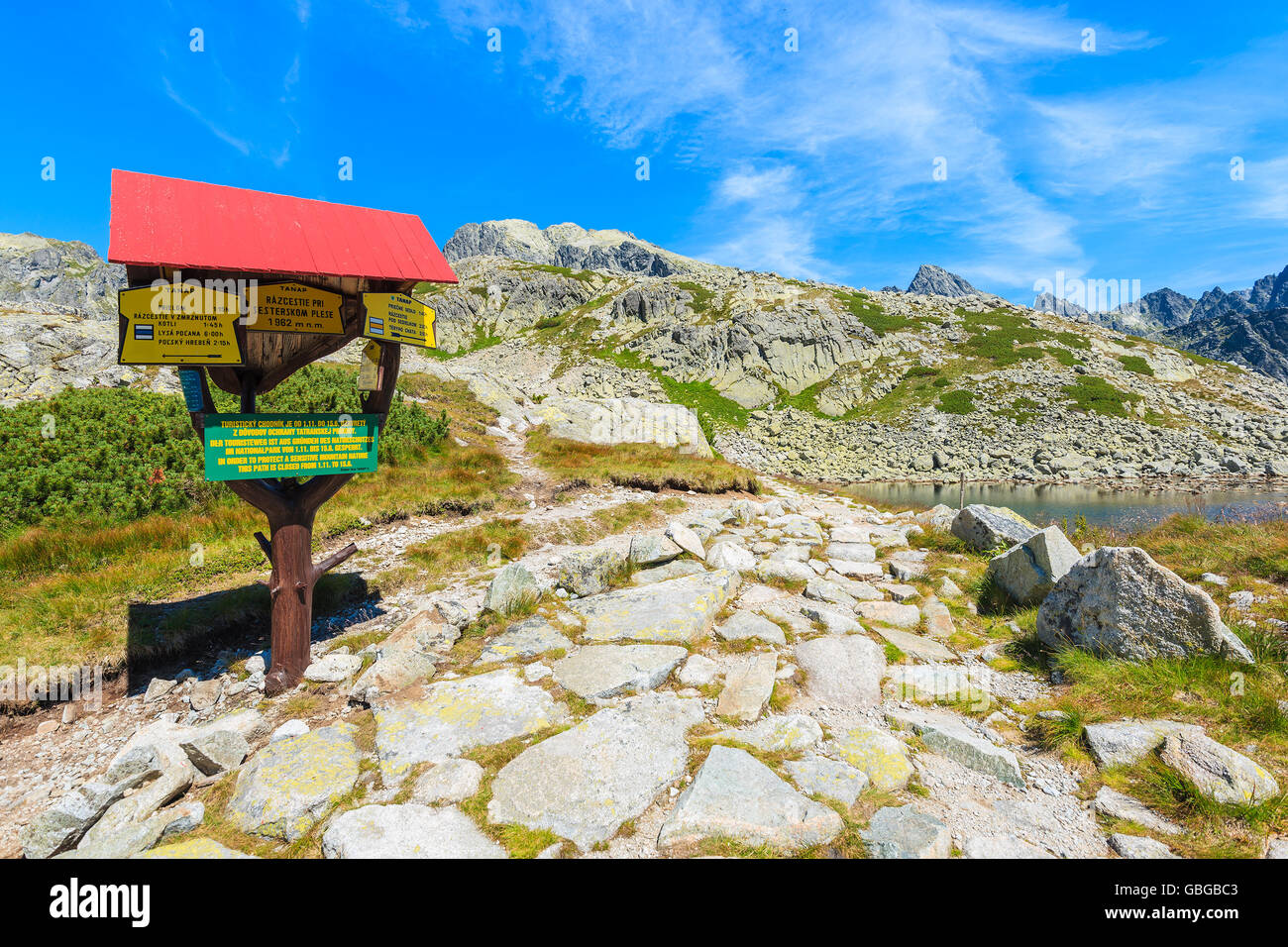 Sign with walk time distances on hiking trail in Starolesna valley ...