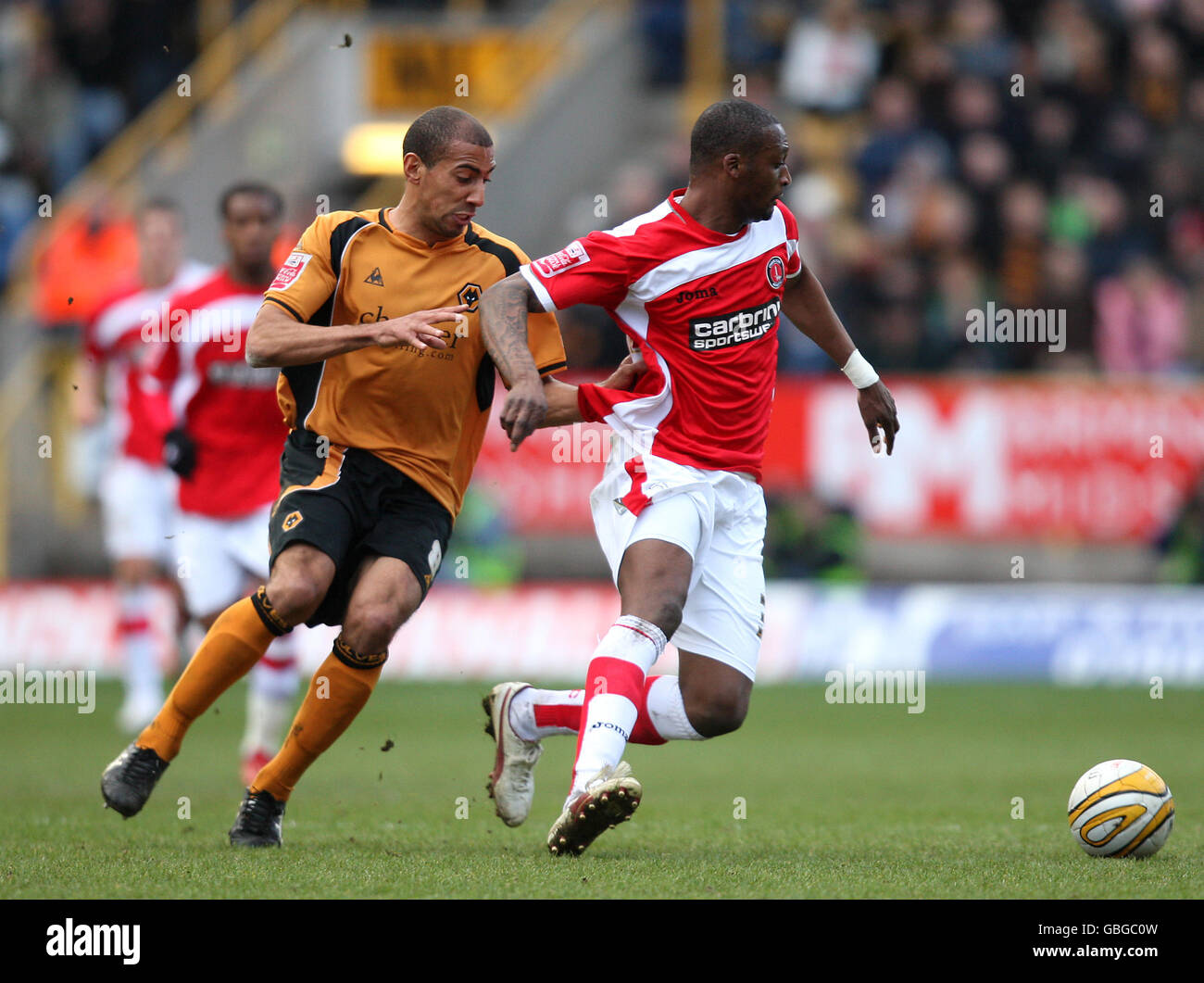 Charlton Athletic's Tresor Kandol and Wolves' Karl Henry compete for ...